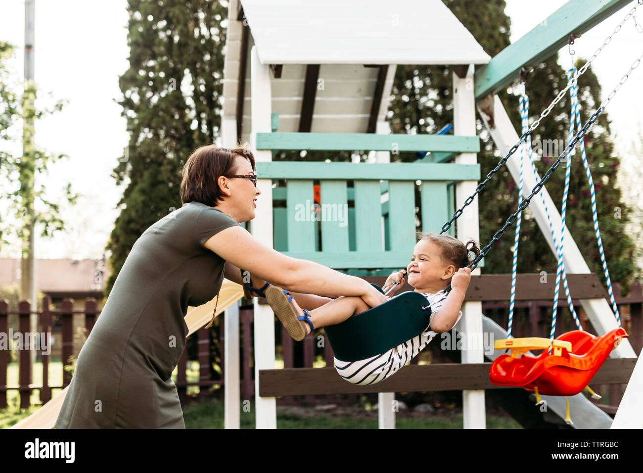 Pushing Swing Stock Photos & Pushing Swing Stock Images - Alamy