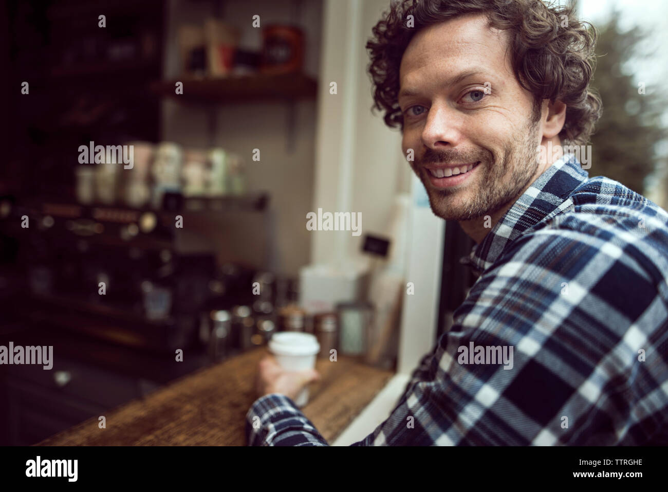 Happy man sitting hi-res stock photography and images - Alamy