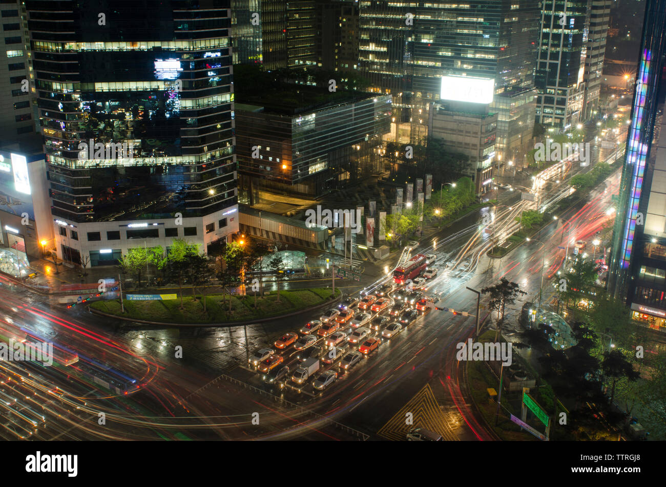 Illuminated cars on city street Stock Photo - Alamy