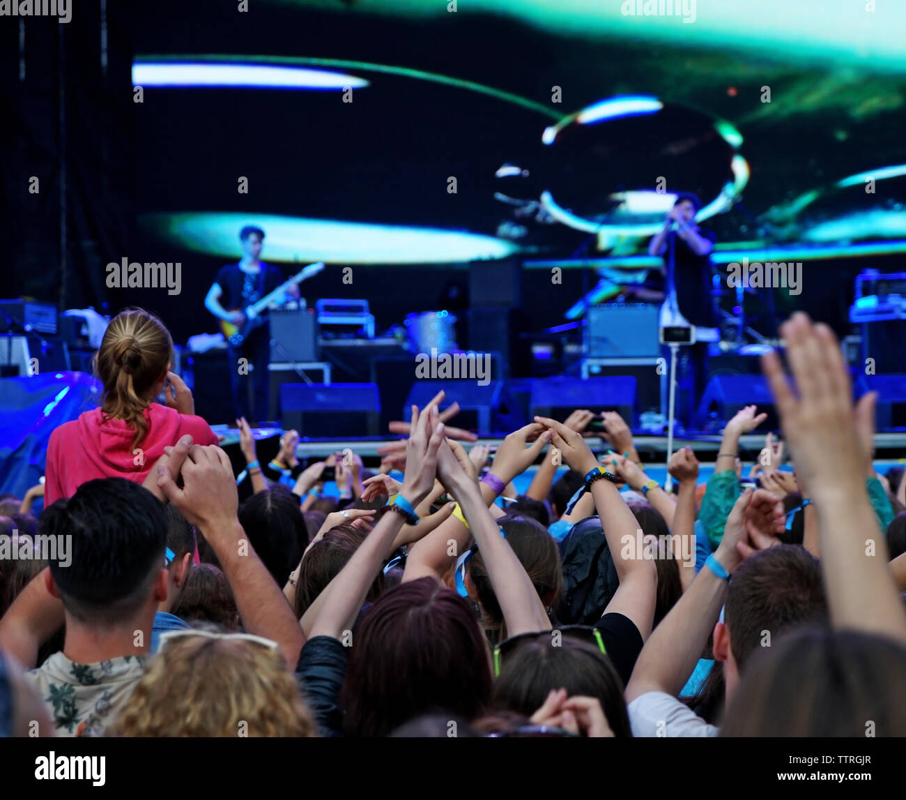 Crowd music fans waving hands hi-res stock photography and images - Alamy