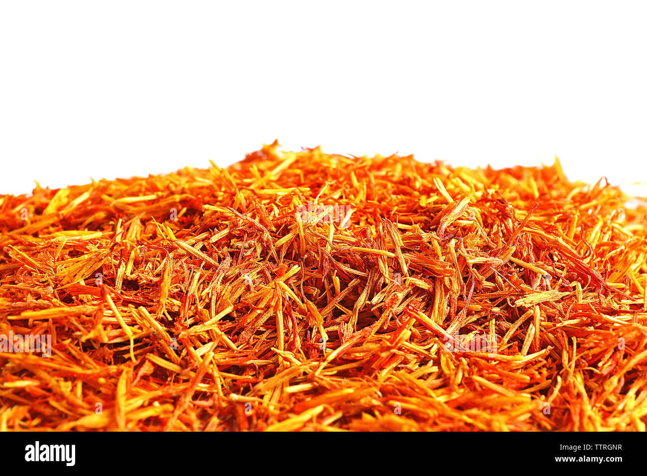 Heap of saffron on white background Stock Photo - Alamy