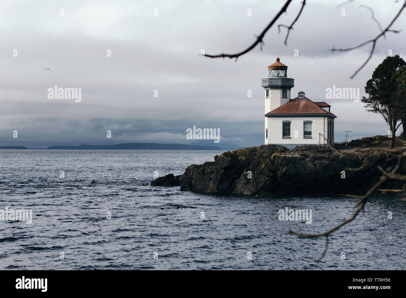 Lighthouse sea against cloudy hi-res stock photography and images - Alamy