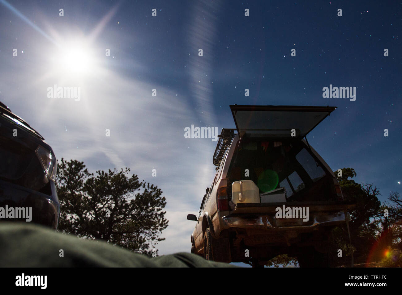 Low angle view of cars against sky on sunny day Stock Photo - Alamy
