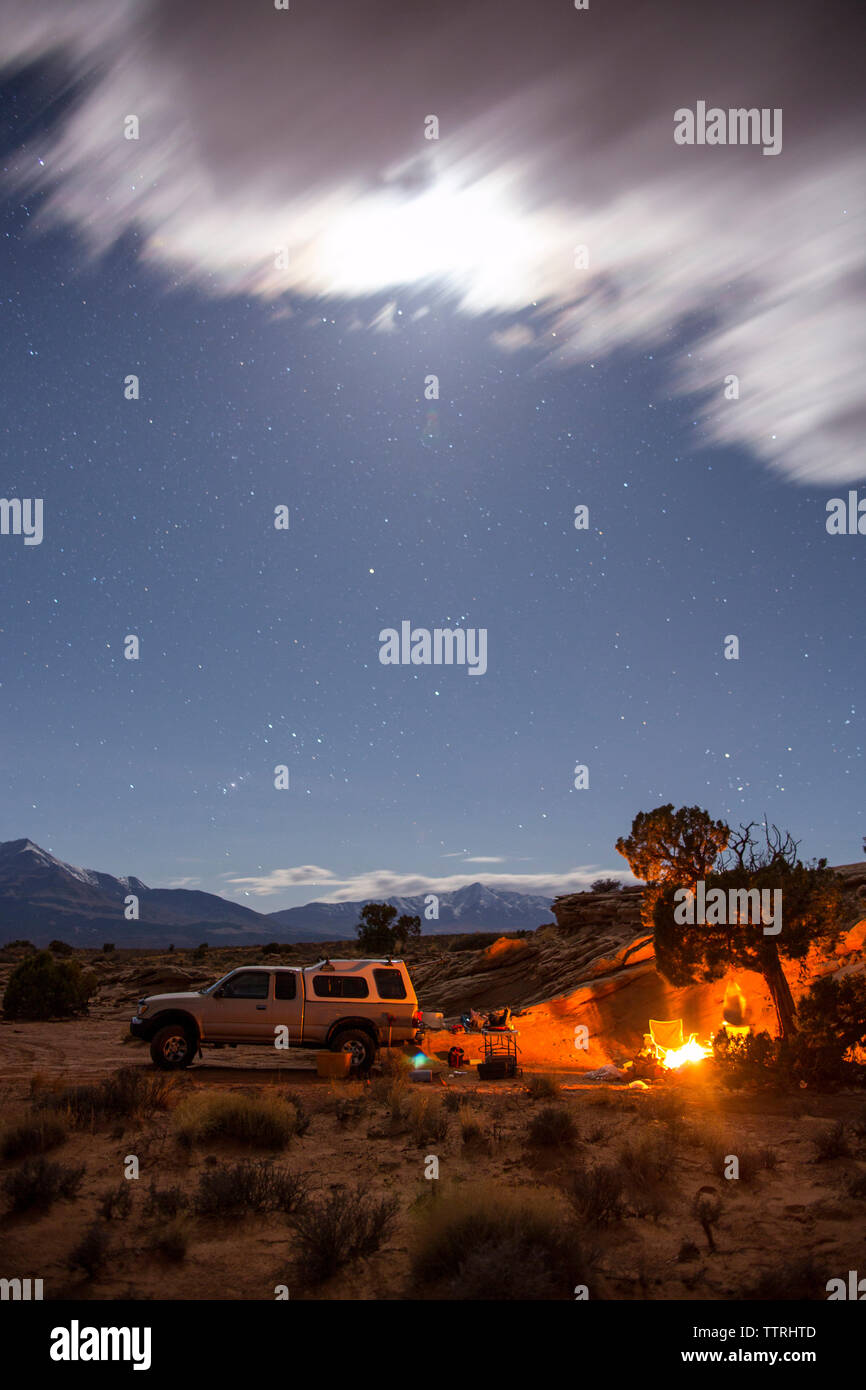 Campfire on field against sky at night Stock Photo - Alamy