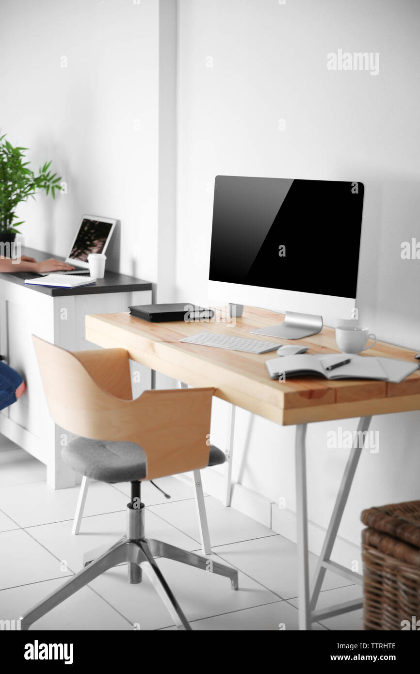 Working place on white wall background Stock Photo - Alamy