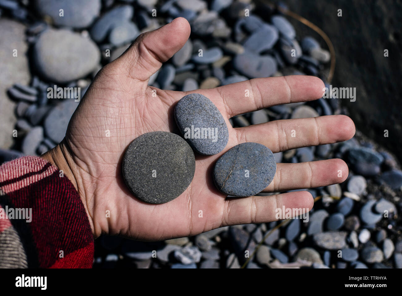 Hand pebbles hi-res stock photography and images - Alamy