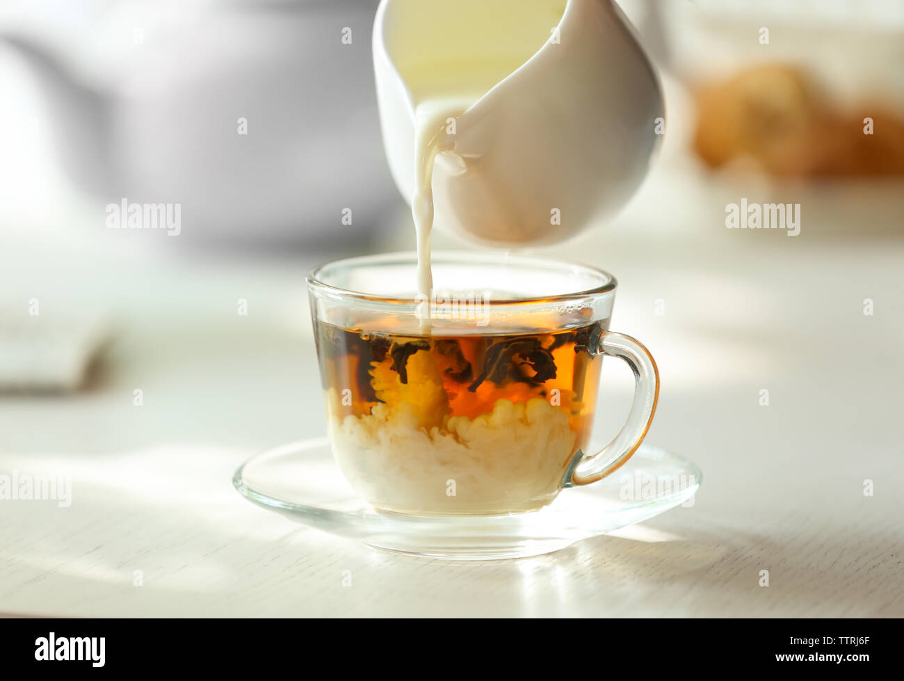 Milk mixing into tea hi-res stock photography and images - Alamy