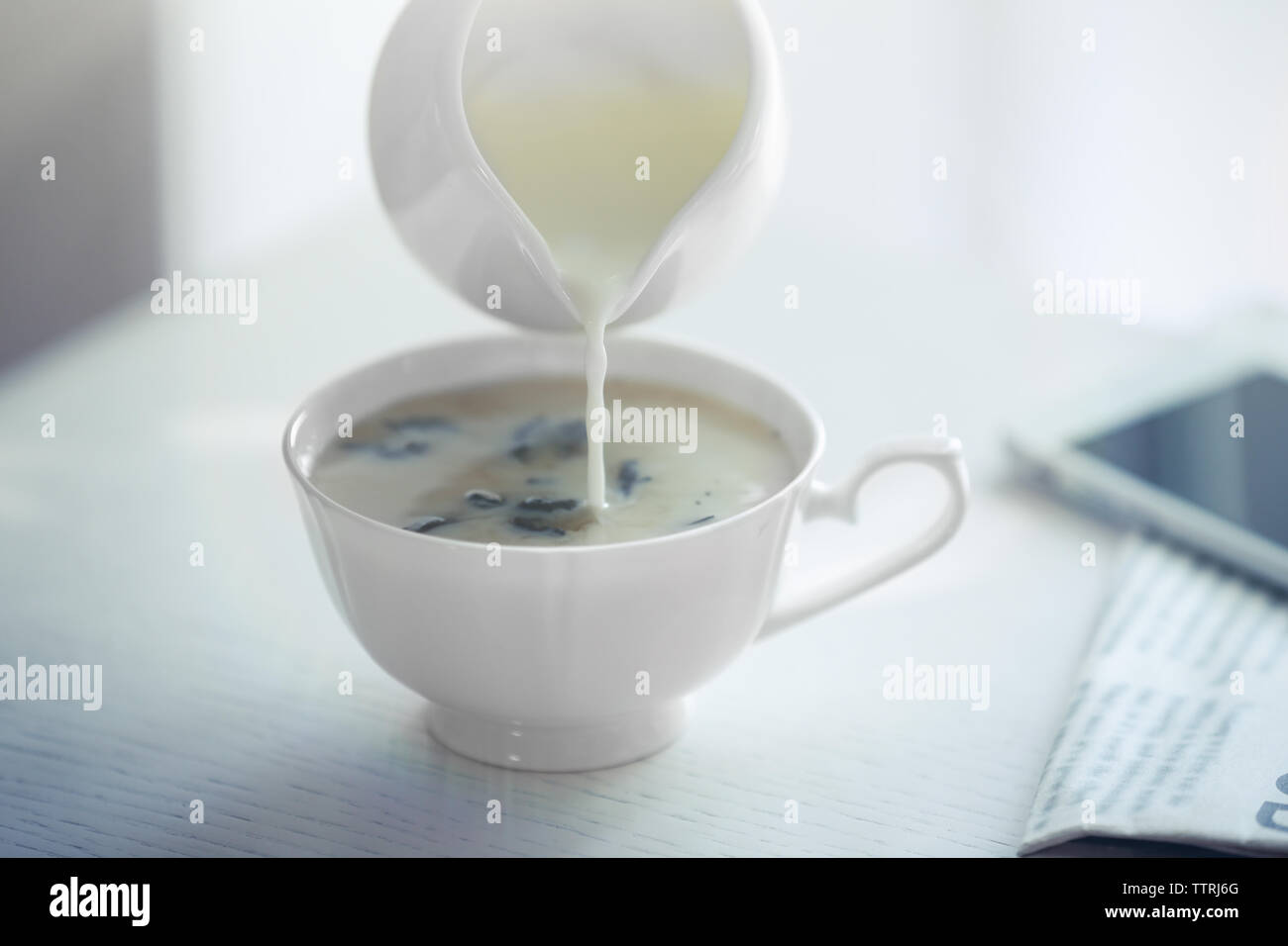 Milk mixing into tea hi-res stock photography and images - Alamy