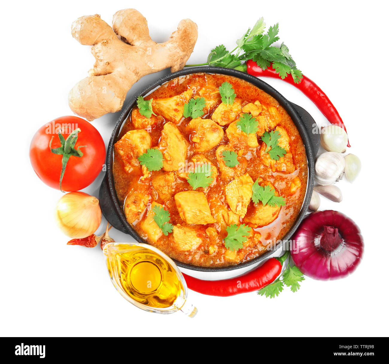 Chicken curry with vegetables on a white background Stock Photo - Alamy