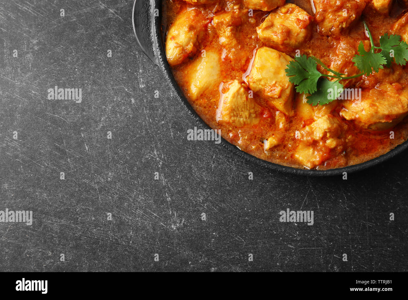 Chicken curry on dark background Stock Photo - Alamy