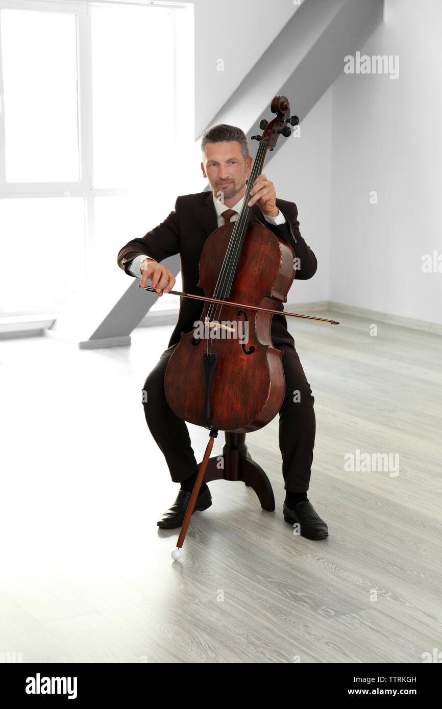Man in suit playing instrument work hi-res stock photography and images ...