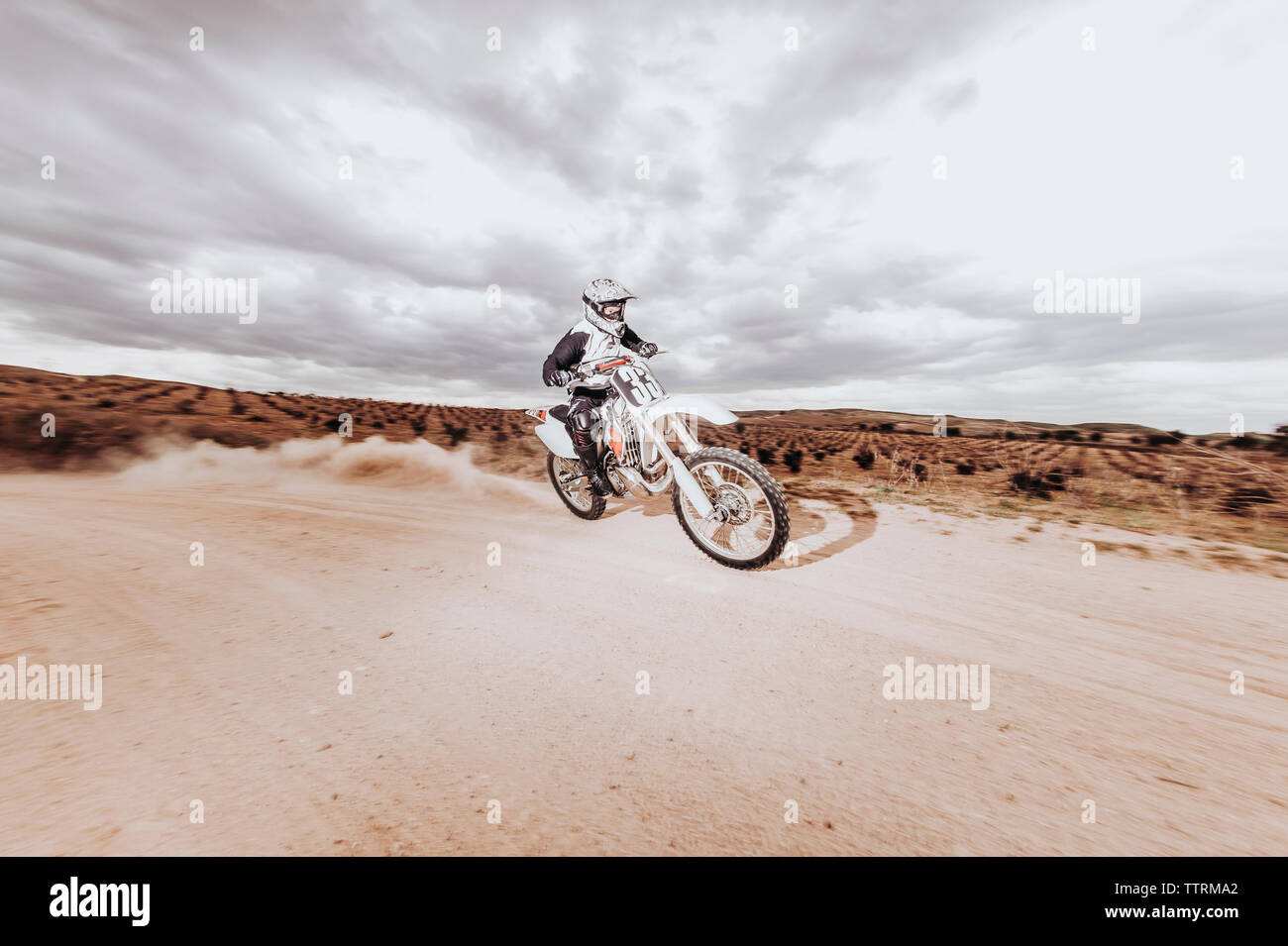 Man driving motorbike stepping on the road very fast Stock Photo - Alamy