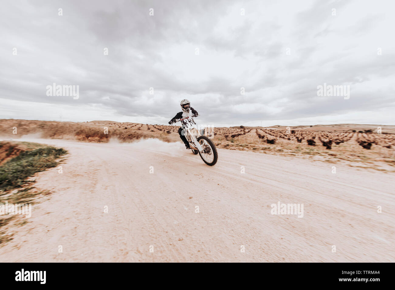 Man driving motorbike stepping on the road very fast Stock Photo - Alamy