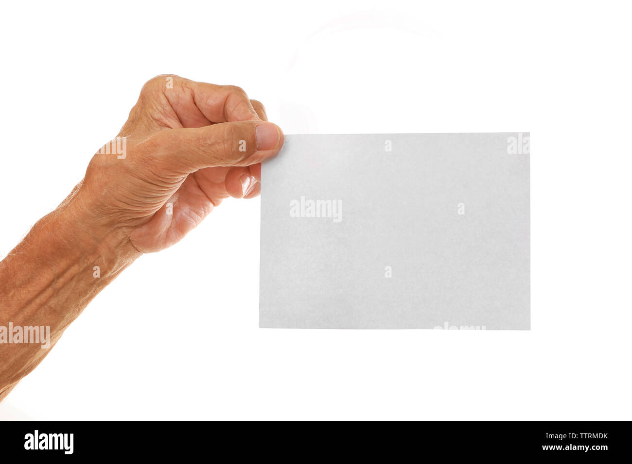 Old man hand holding sheet of paper on a white background Stock Photo ...