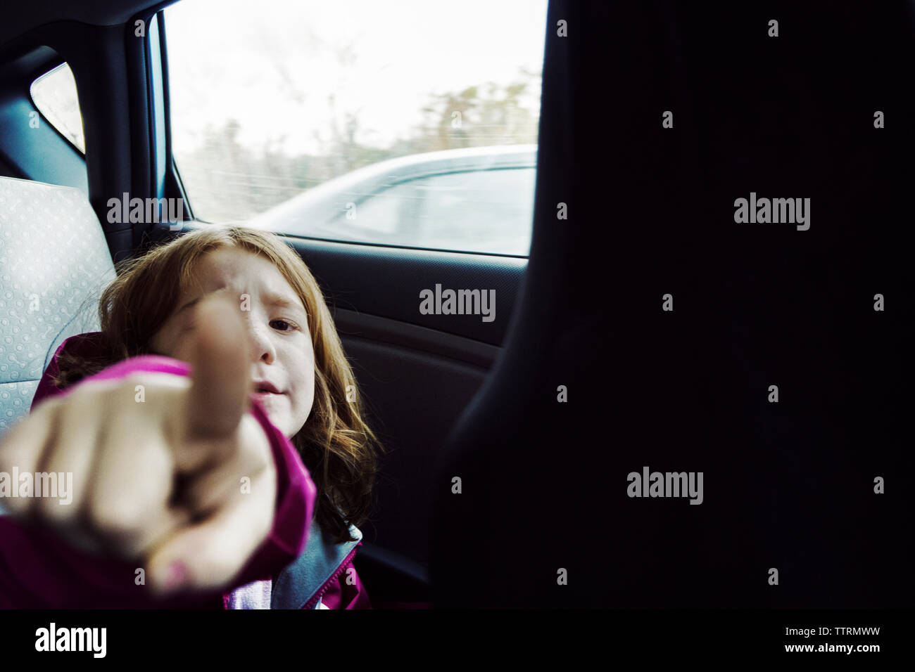 Female sitting pointing hi-res stock photography and images - Alamy