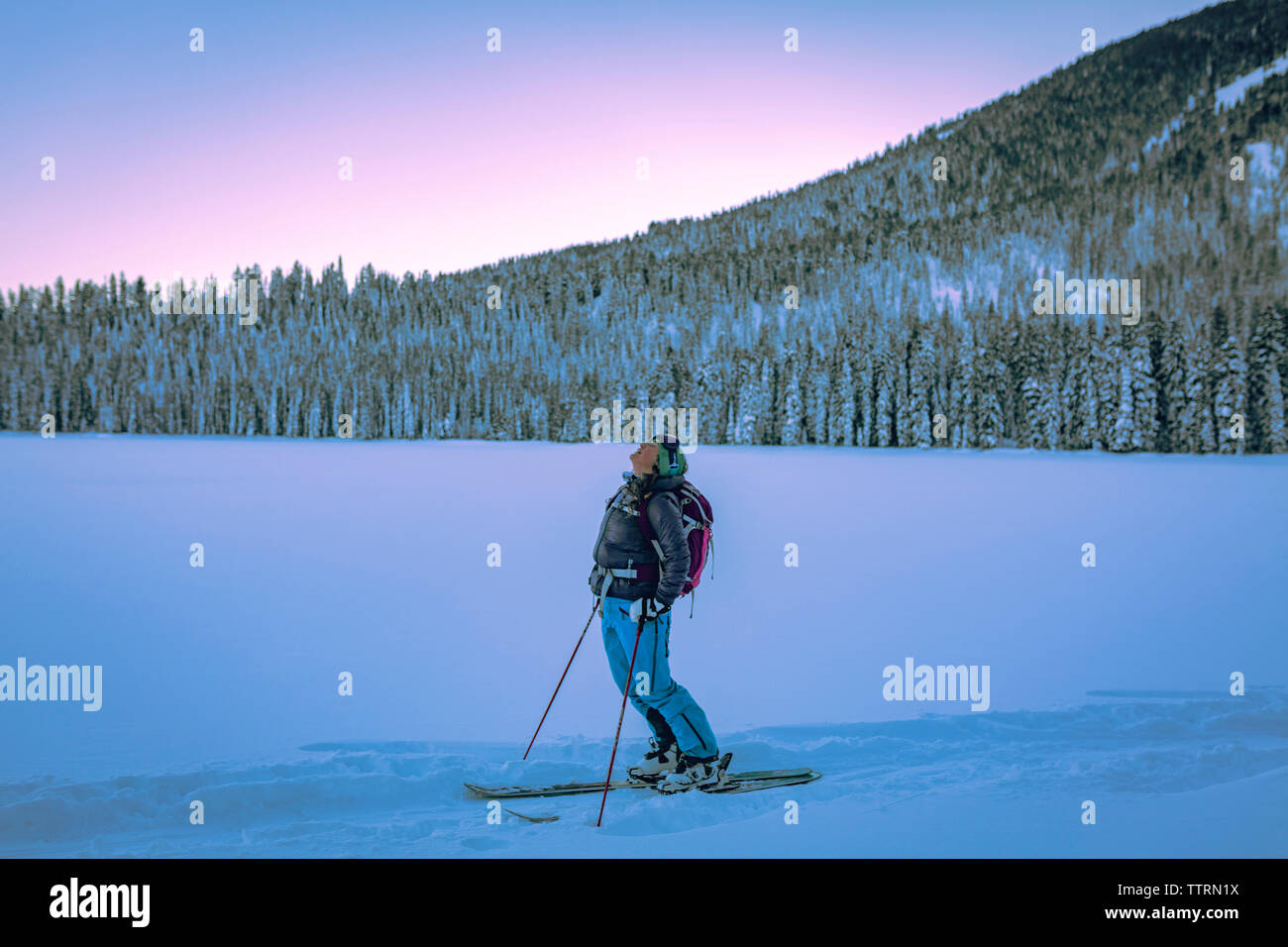 Female standing on snow hi-res stock photography and images - Alamy