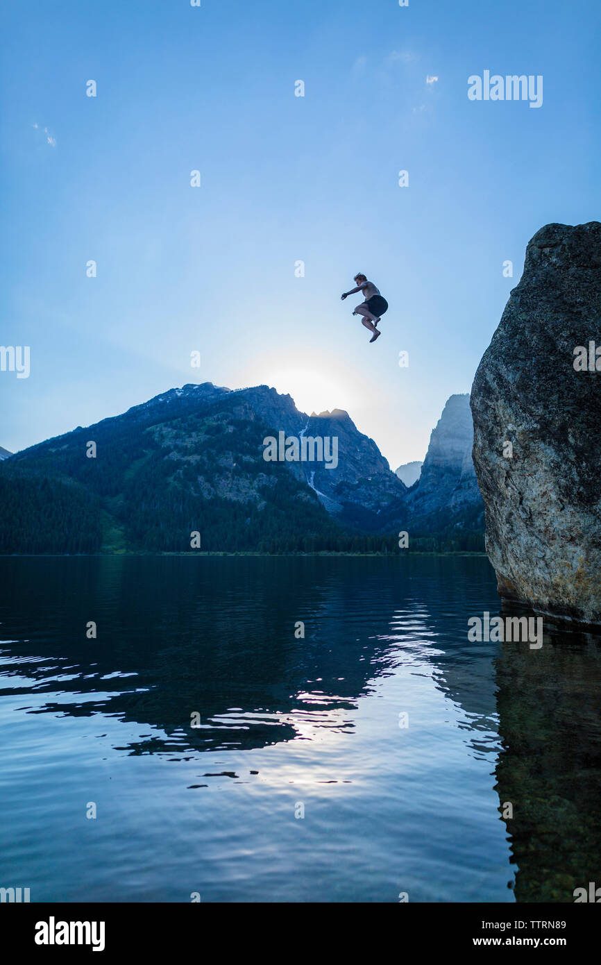 Boy jumping cliff hi-res stock photography and images - Alamy