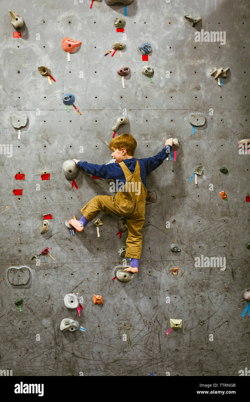 Boy climbing wall hi-res stock photography and images - Alamy