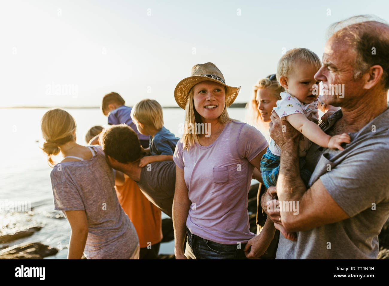 Women and children standing hi-res stock photography and images - Alamy