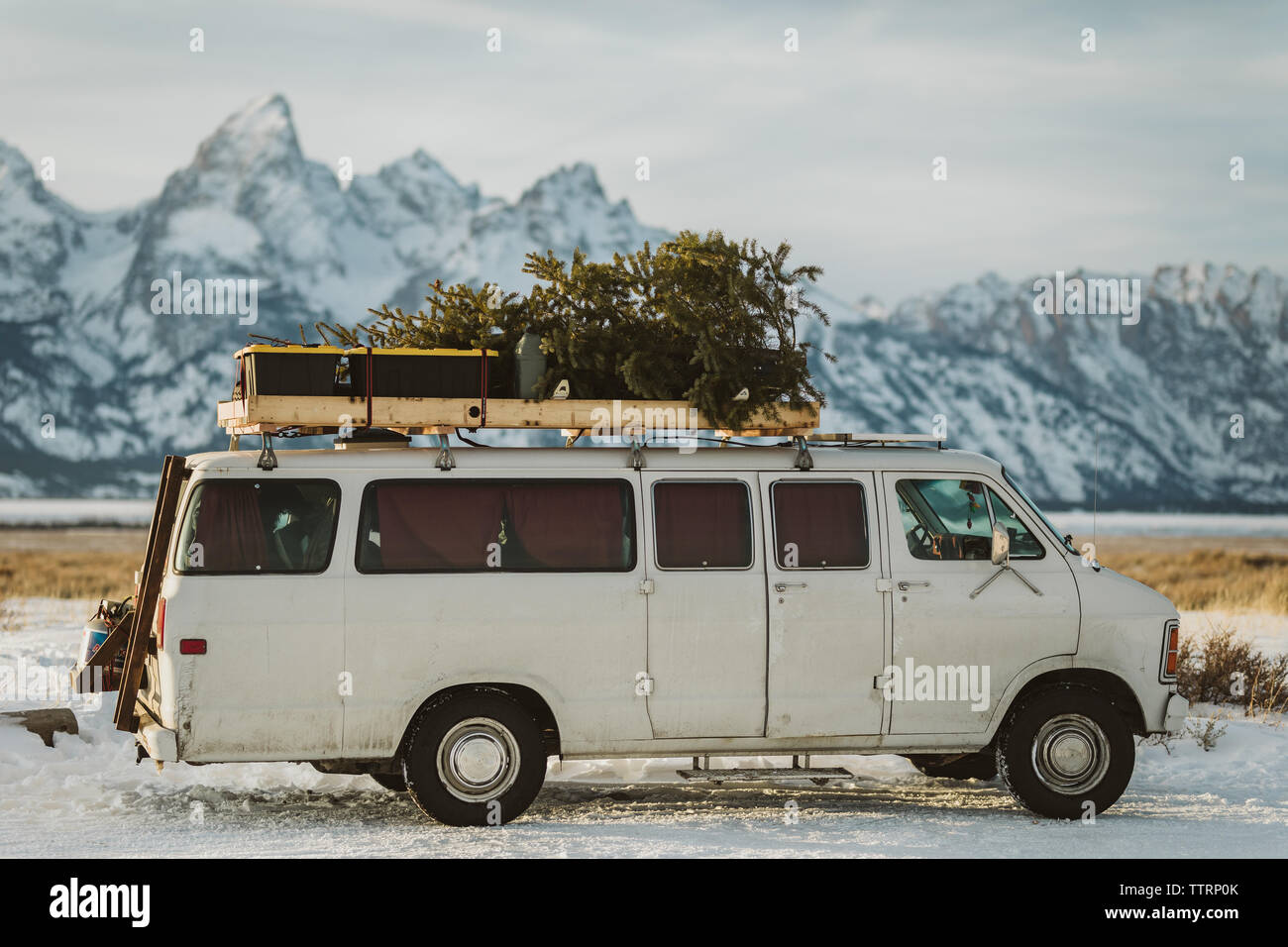 Van life in the tetons parked roadside with christmas tree Stock Photo ...