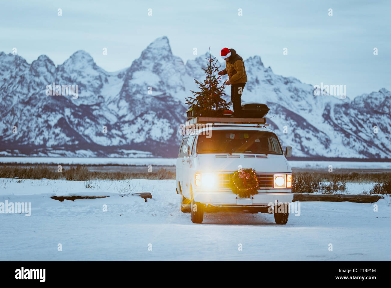 Passenger van decorated for christmas in the mountains Stock Photo - Alamy