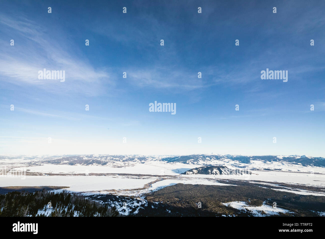 open blue sky above jackson hole valley in winter Stock Photo - Alamy