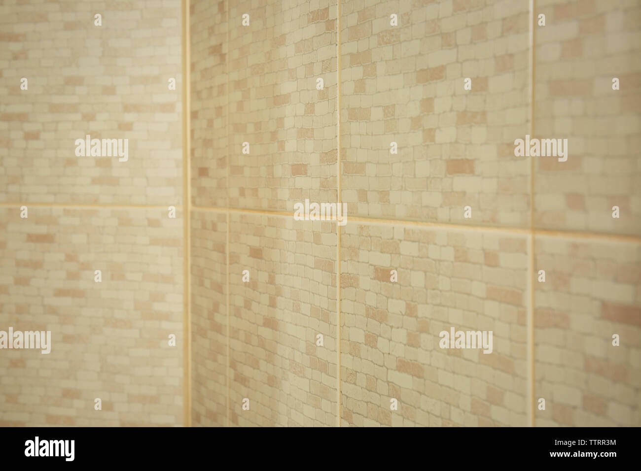 Beige ceramic tiles wall Stock Photo - Alamy