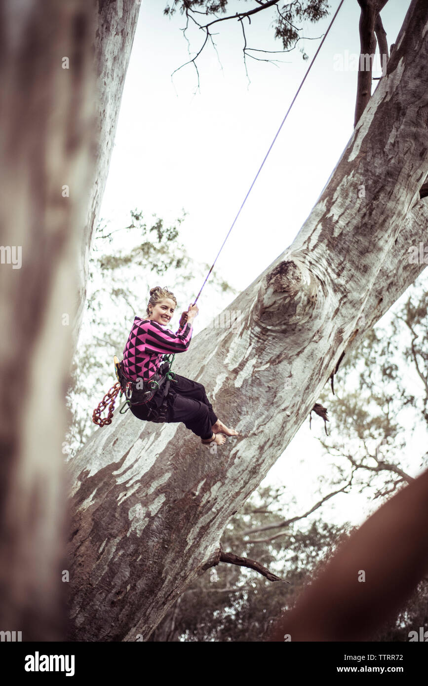 Woman hanging from rope hi-res stock photography and images - Alamy