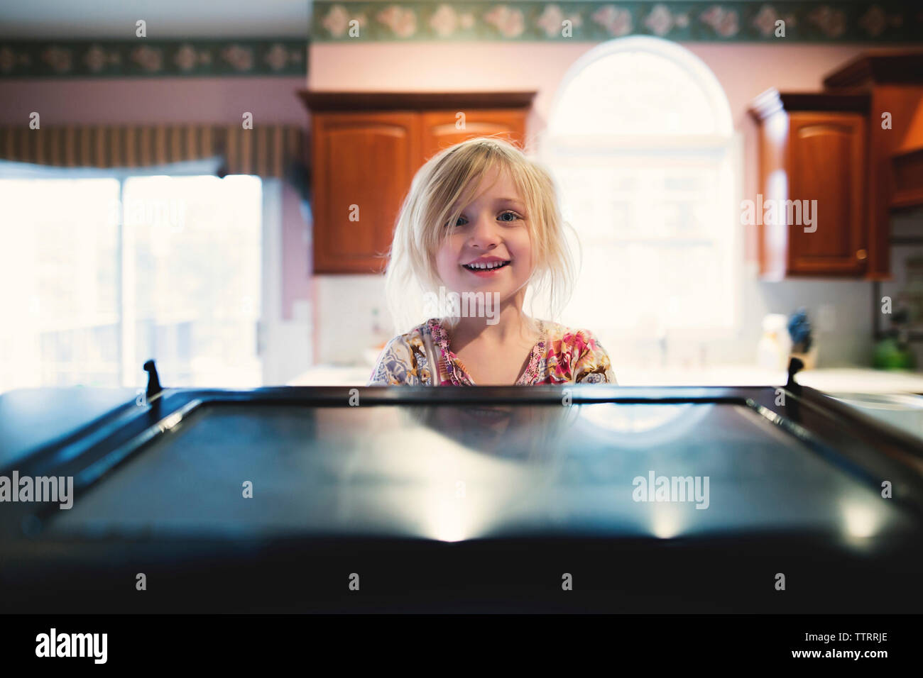 Girl sitting table hi-res stock photography and images - Alamy