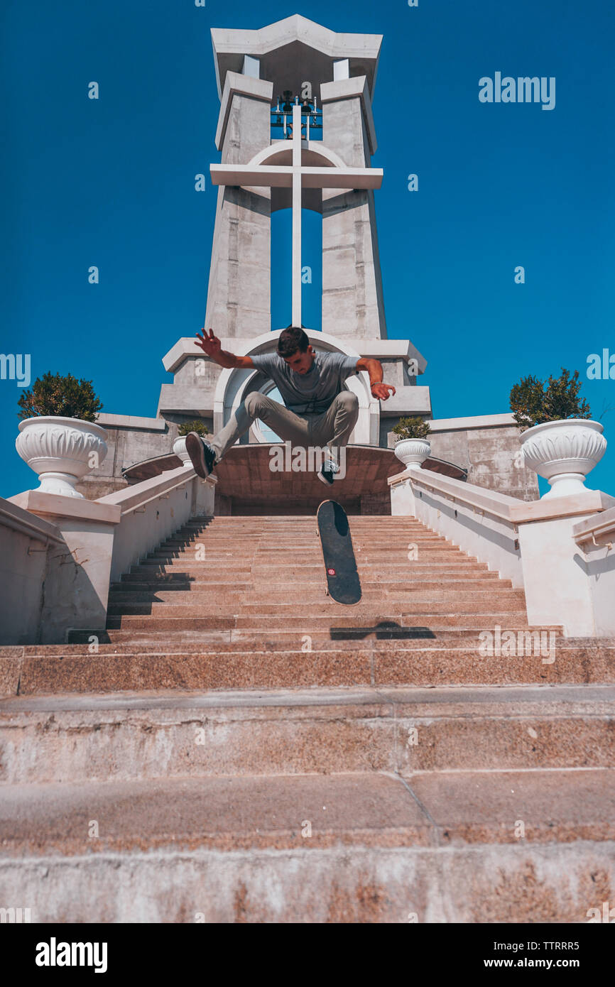 Skater doing an ollie trick at the church skateboard god skate jesus ...