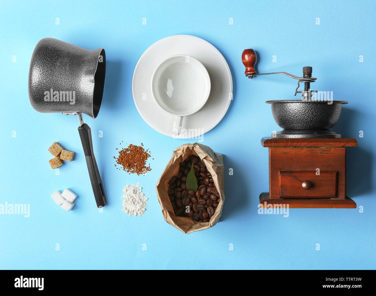 Coffee ingredients on blue background, flat lay Stock Photo - Alamy