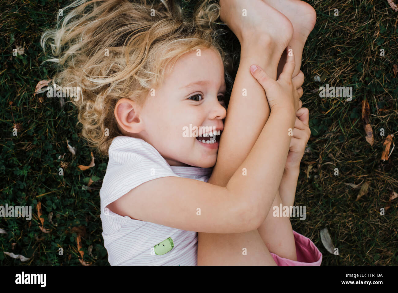 Girl lying grass field hi-res stock photography and images - Alamy