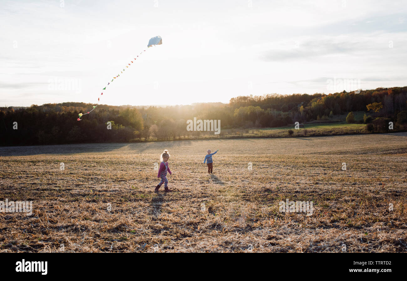 Two people walking kite flying hi-res stock photography and images - Alamy