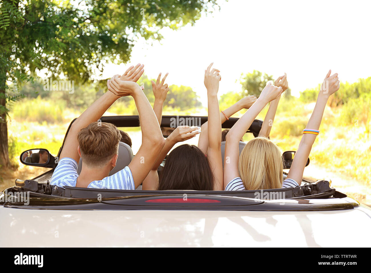 Happy friends in car Stock Photo - Alamy