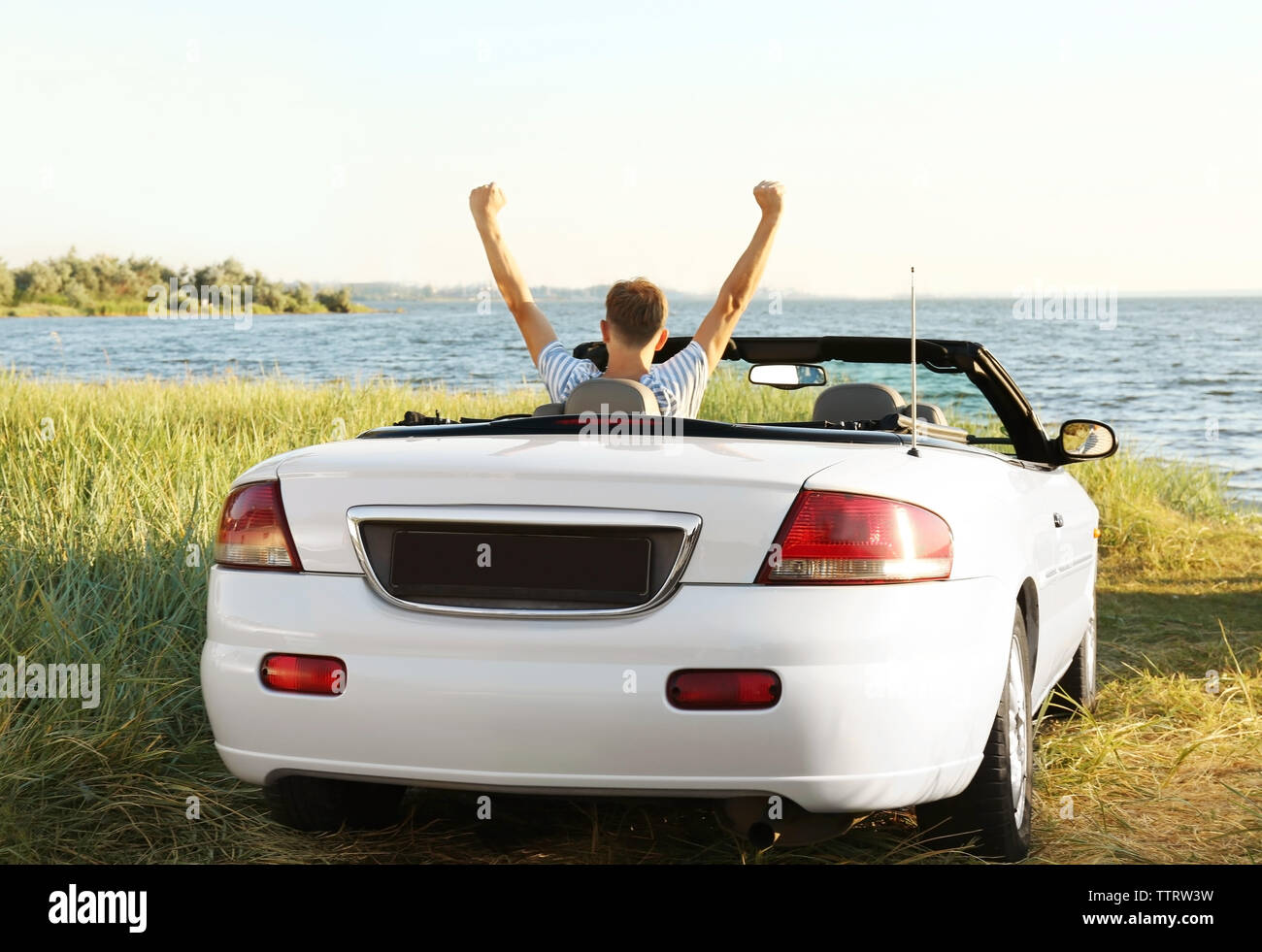 Happy man in car Stock Photo - Alamy