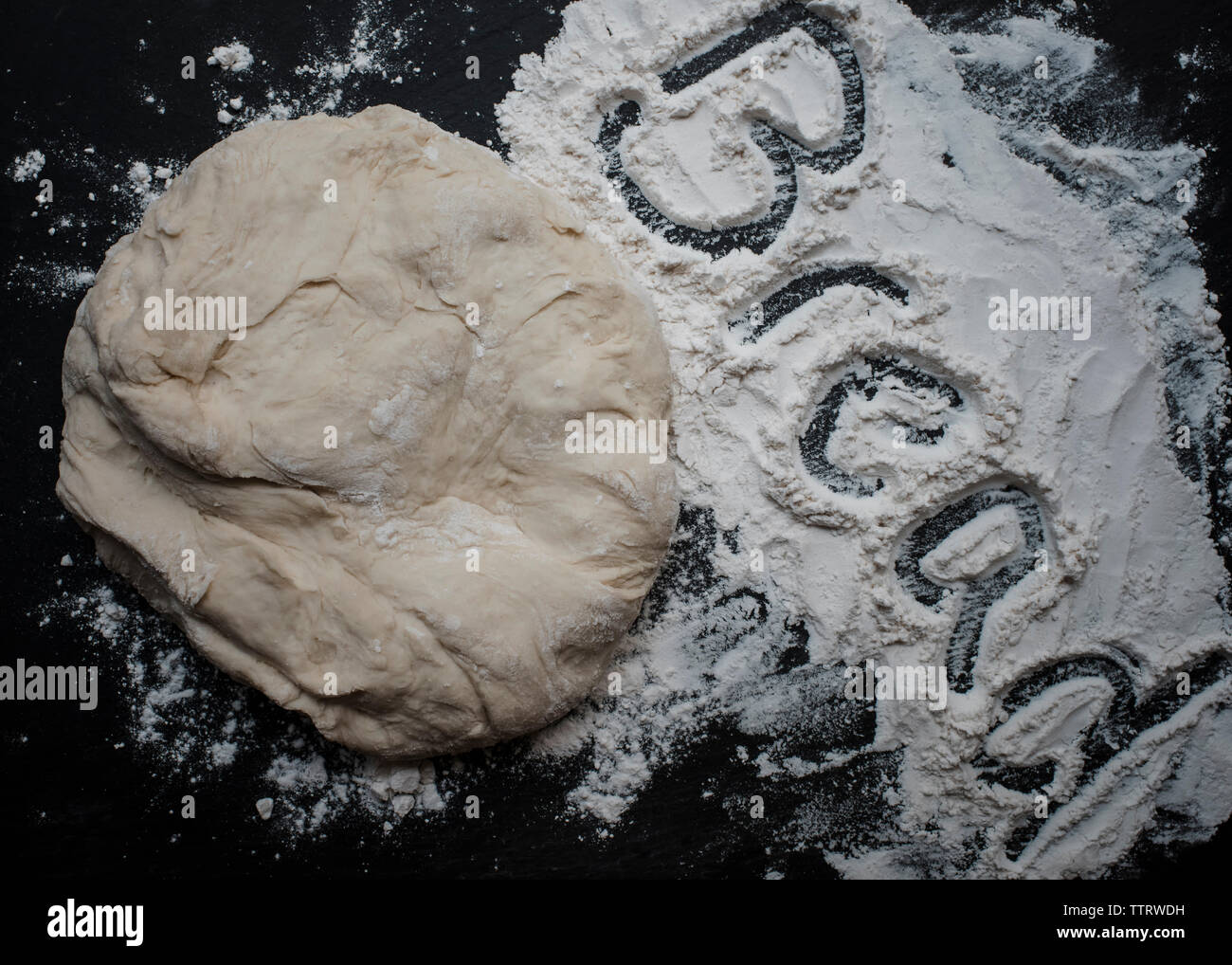 Close-up of bread text on flour by dough at home Stock Photo - Alamy