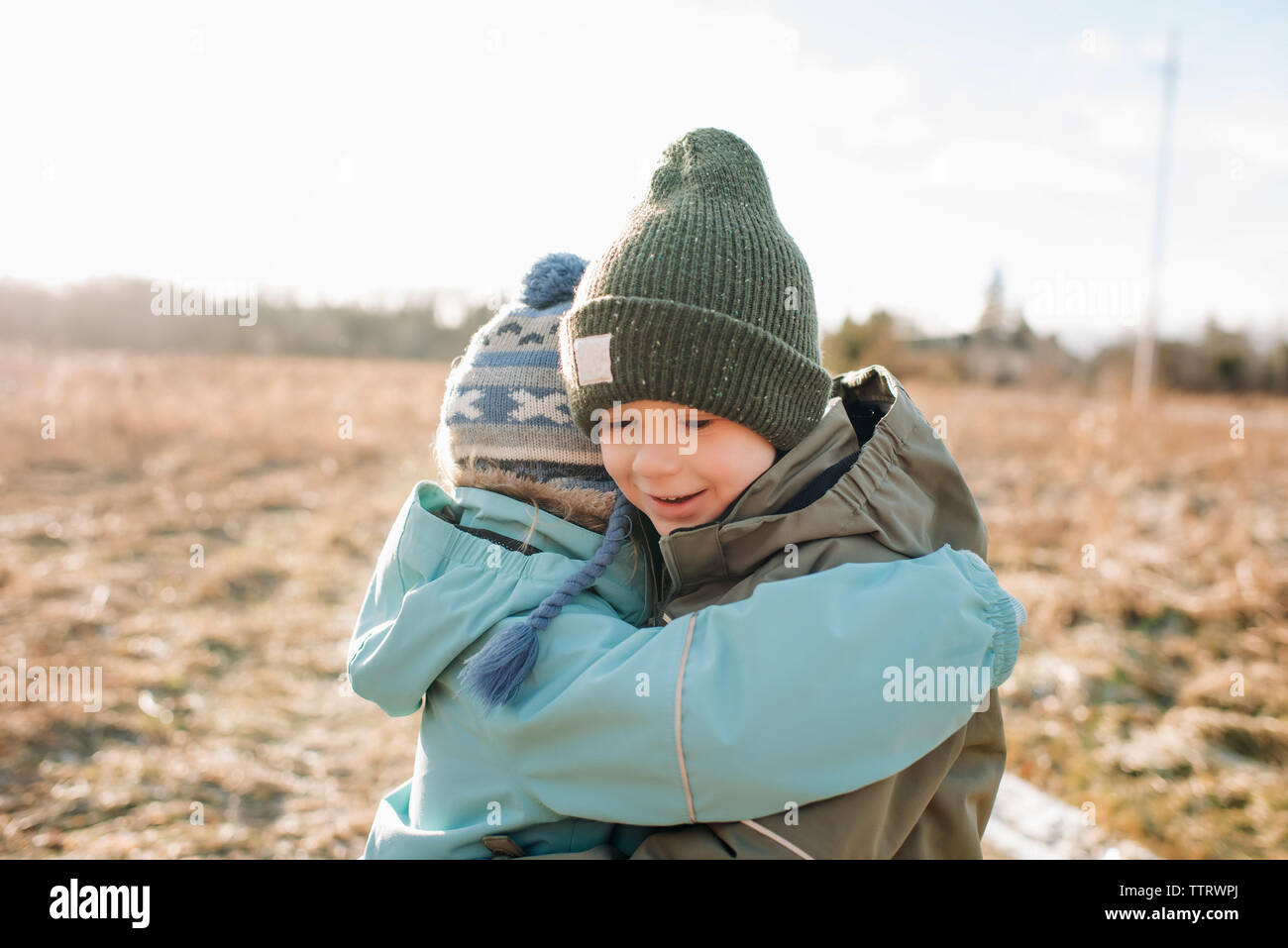 Brother and sister cuddling hi-res stock photography and images - Alamy