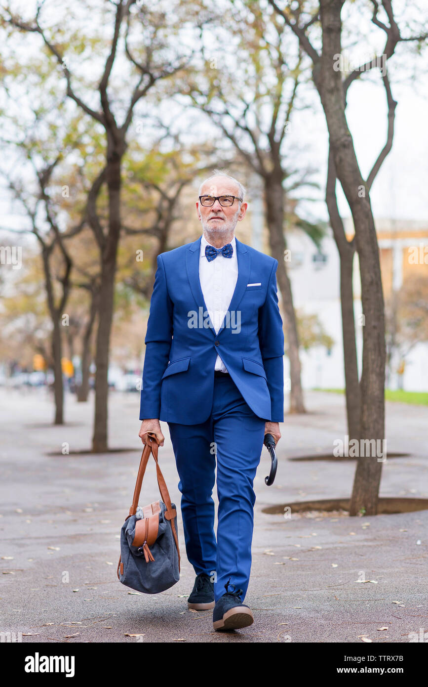 Man wearing suit carrying baby hi-res stock photography and images - Alamy