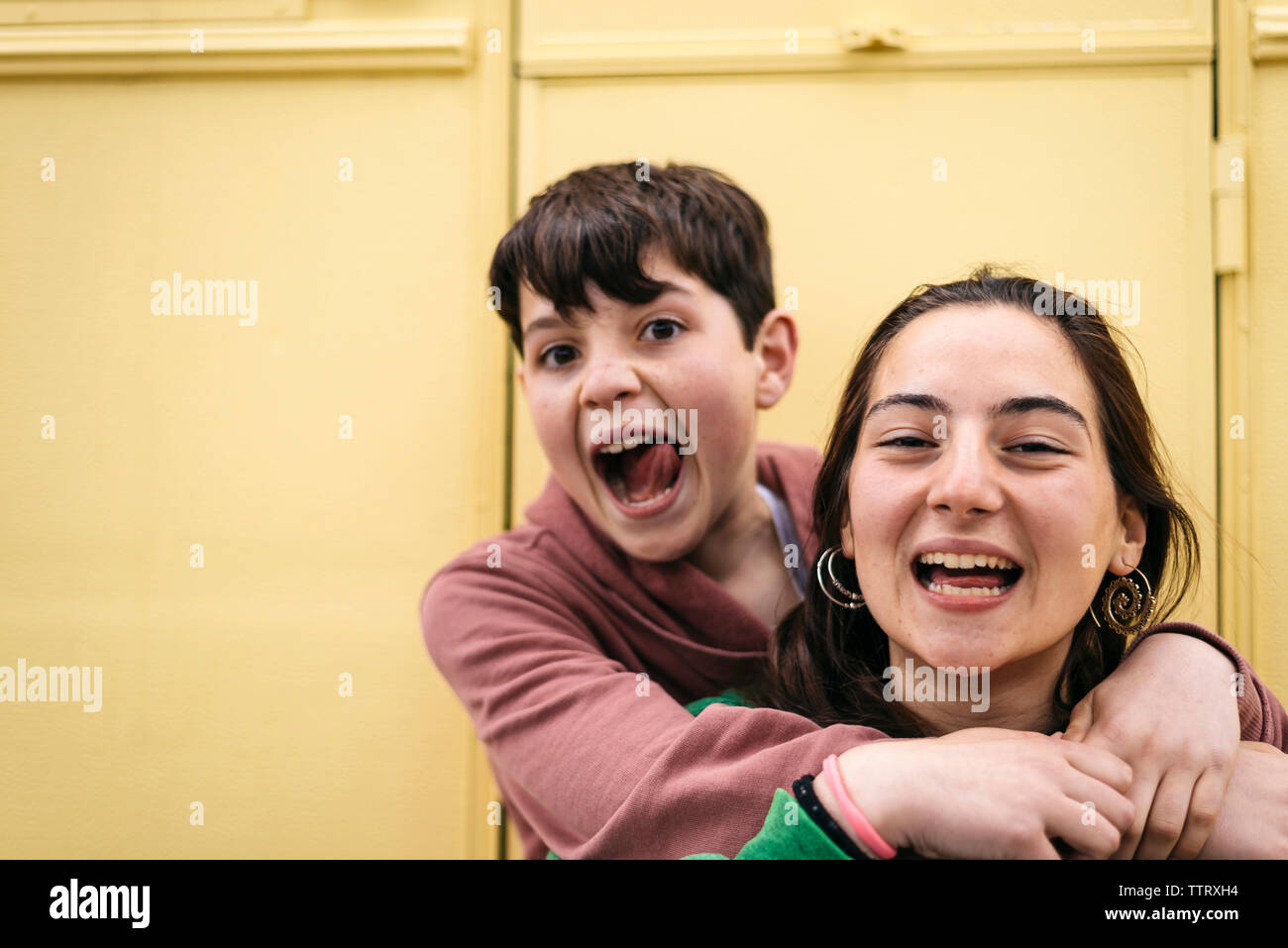 Portrait of teenagers smiling while sitting outdoors Stock Photo - Alamy