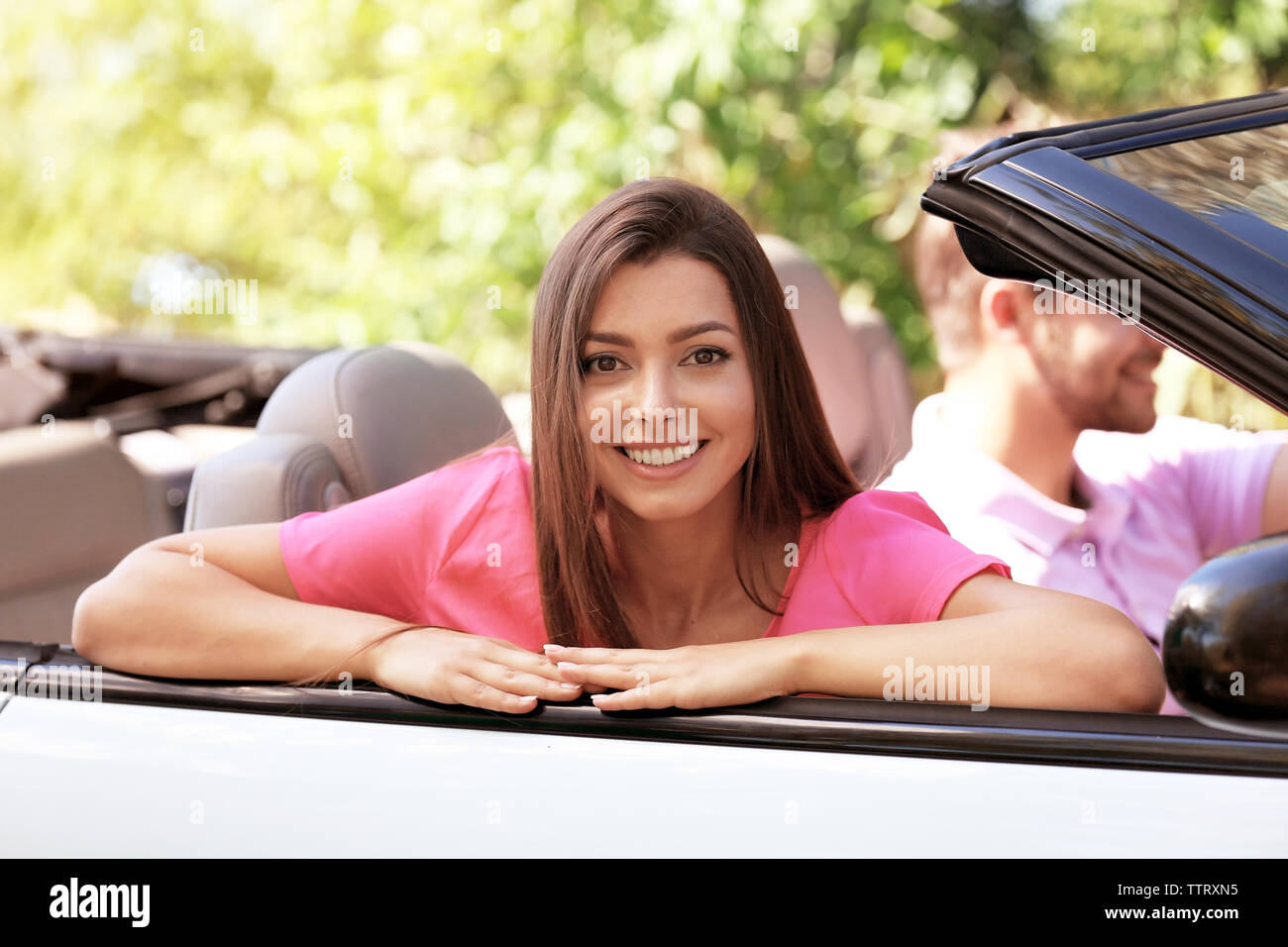 Beautiful woman in car on road trip Stock Photo - Alamy