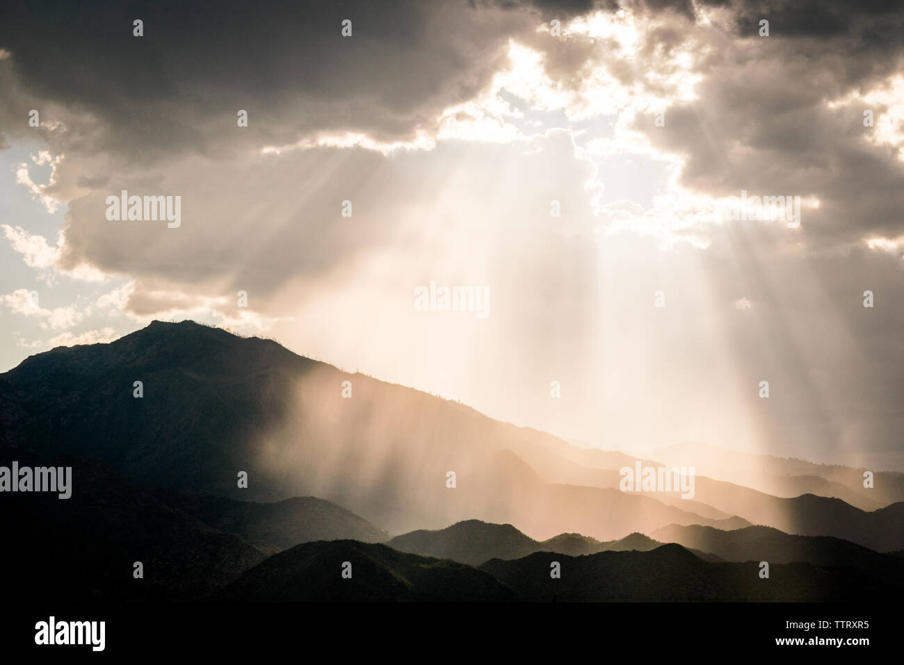 Sun Rays and Beams Reflected on Mountain Layers Stock Photo - Alamy