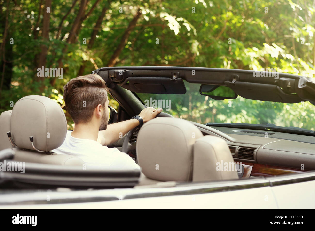 Man driving car on road trip Stock Photo - Alamy