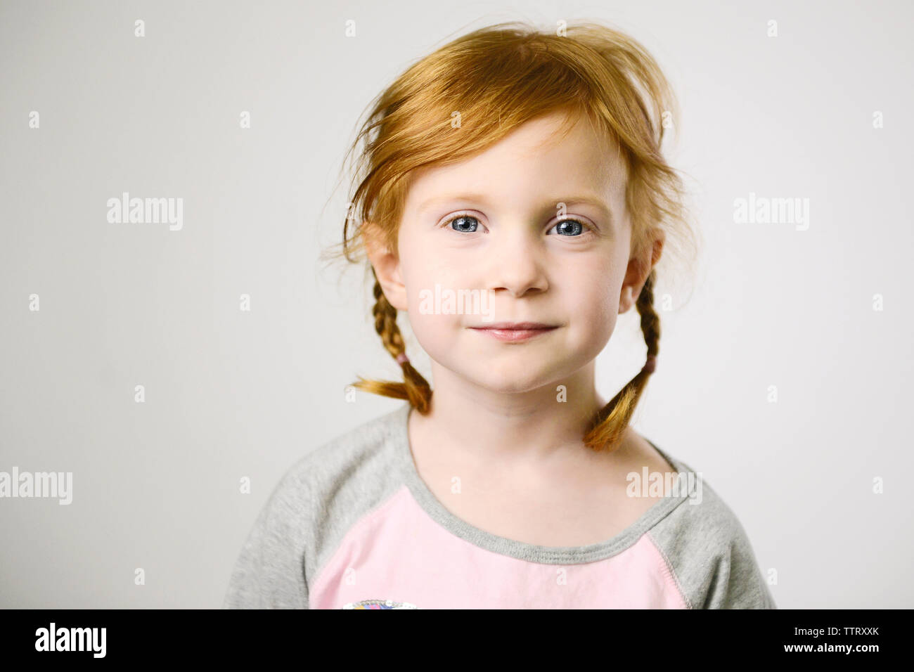 Smiling girl standing white hi-res stock photography and images - Alamy