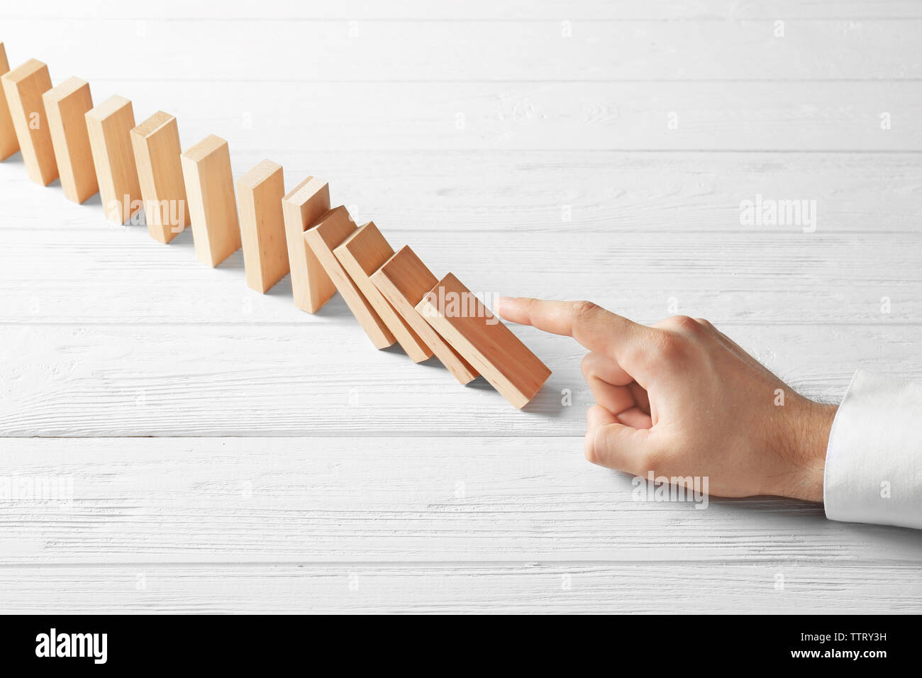 Finger pushing dominoes hi-res stock photography and images - Alamy