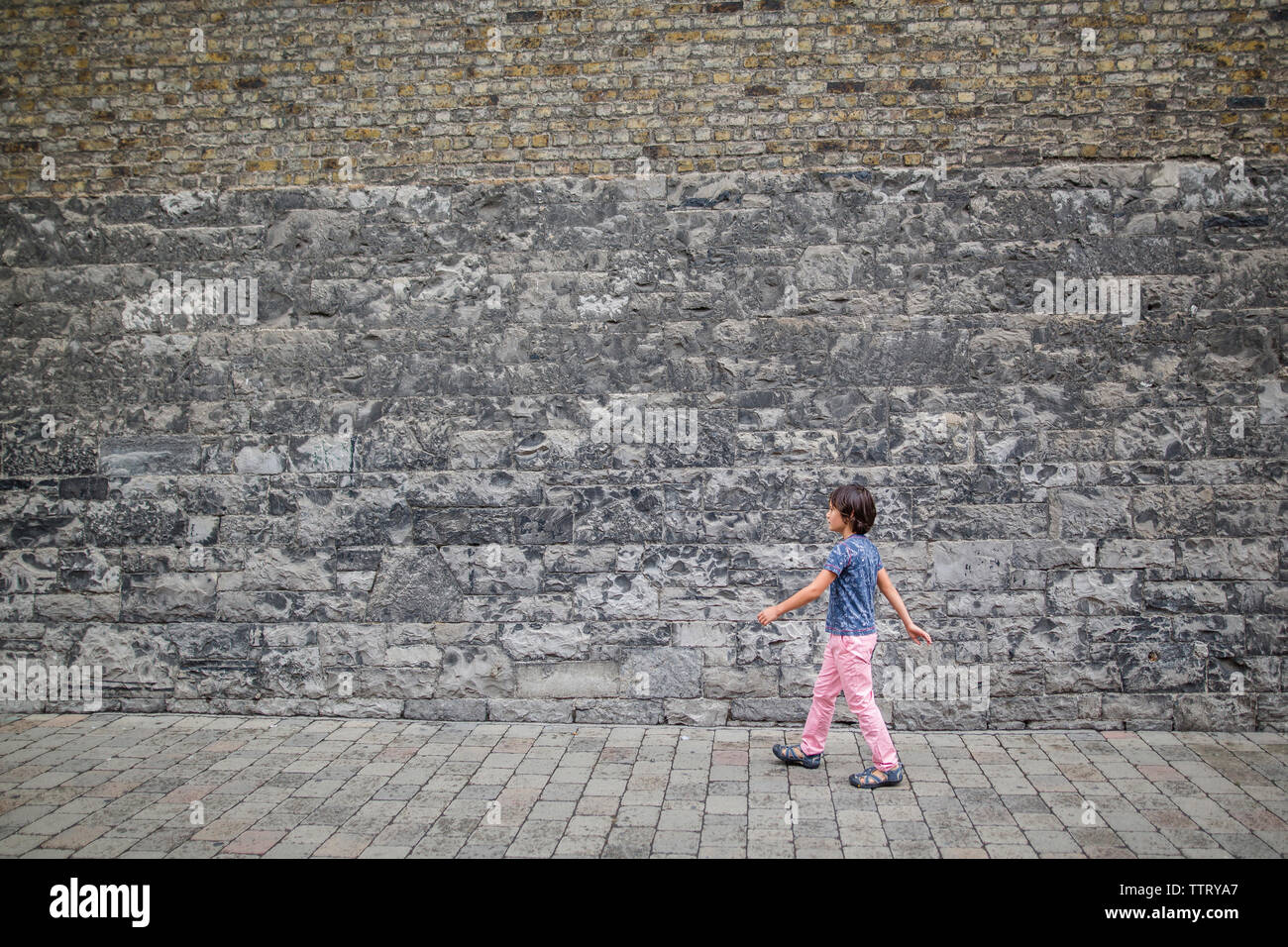 Side profile full length walking hi-res stock photography and images ...