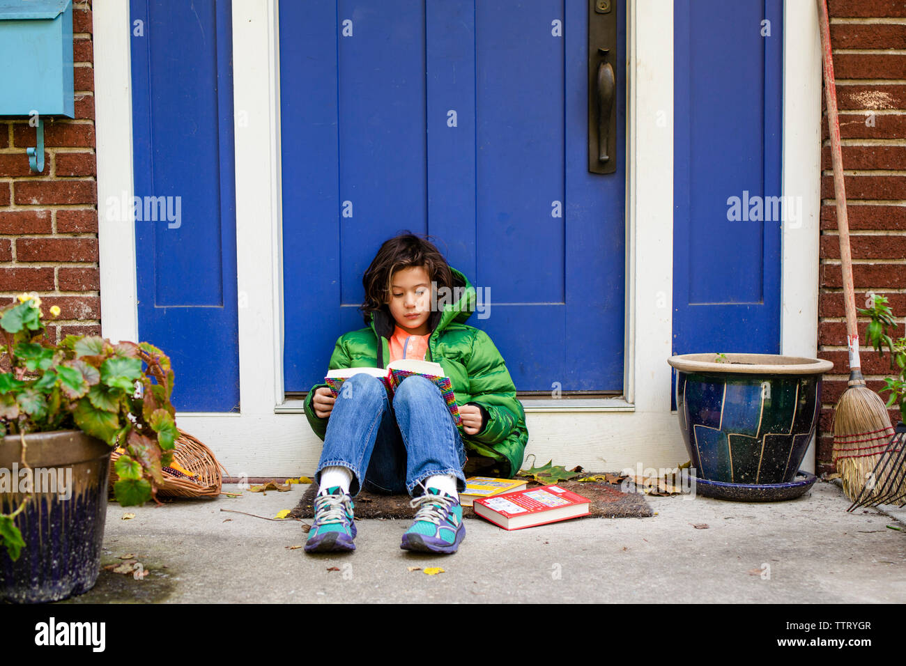 Boy in front of door hi-res stock photography and images - Alamy