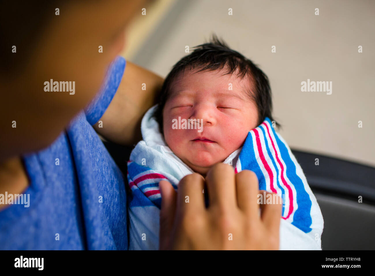 Cradled baby hi-res stock photography and images - Alamy