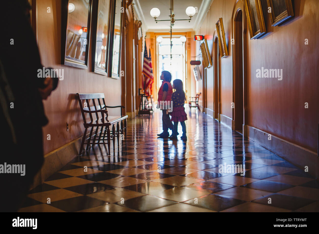 two children stand in the hallway of a government building Stock Photo ...