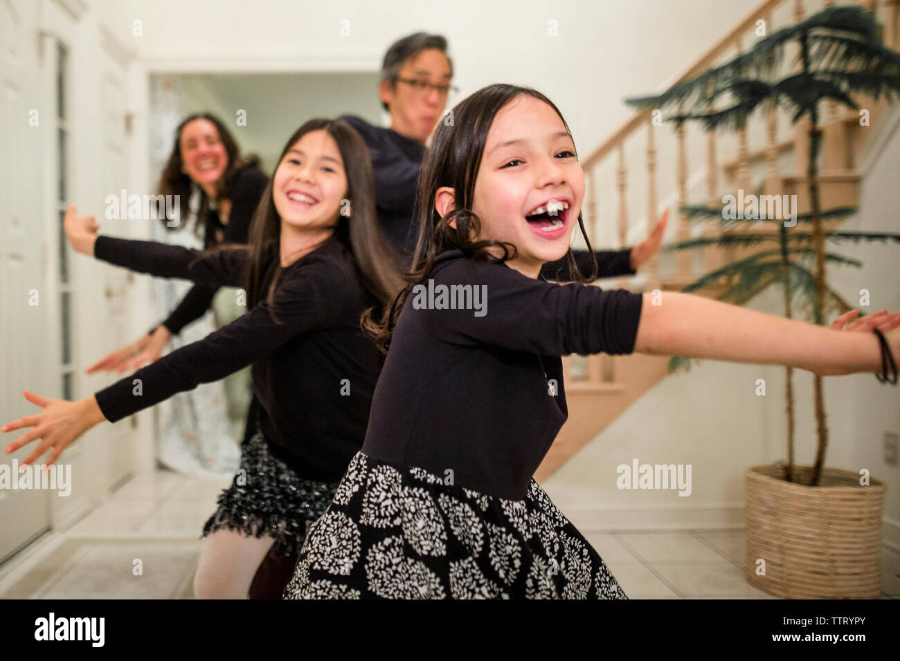 A happy family at home dancing together Stock Photo - Alamy