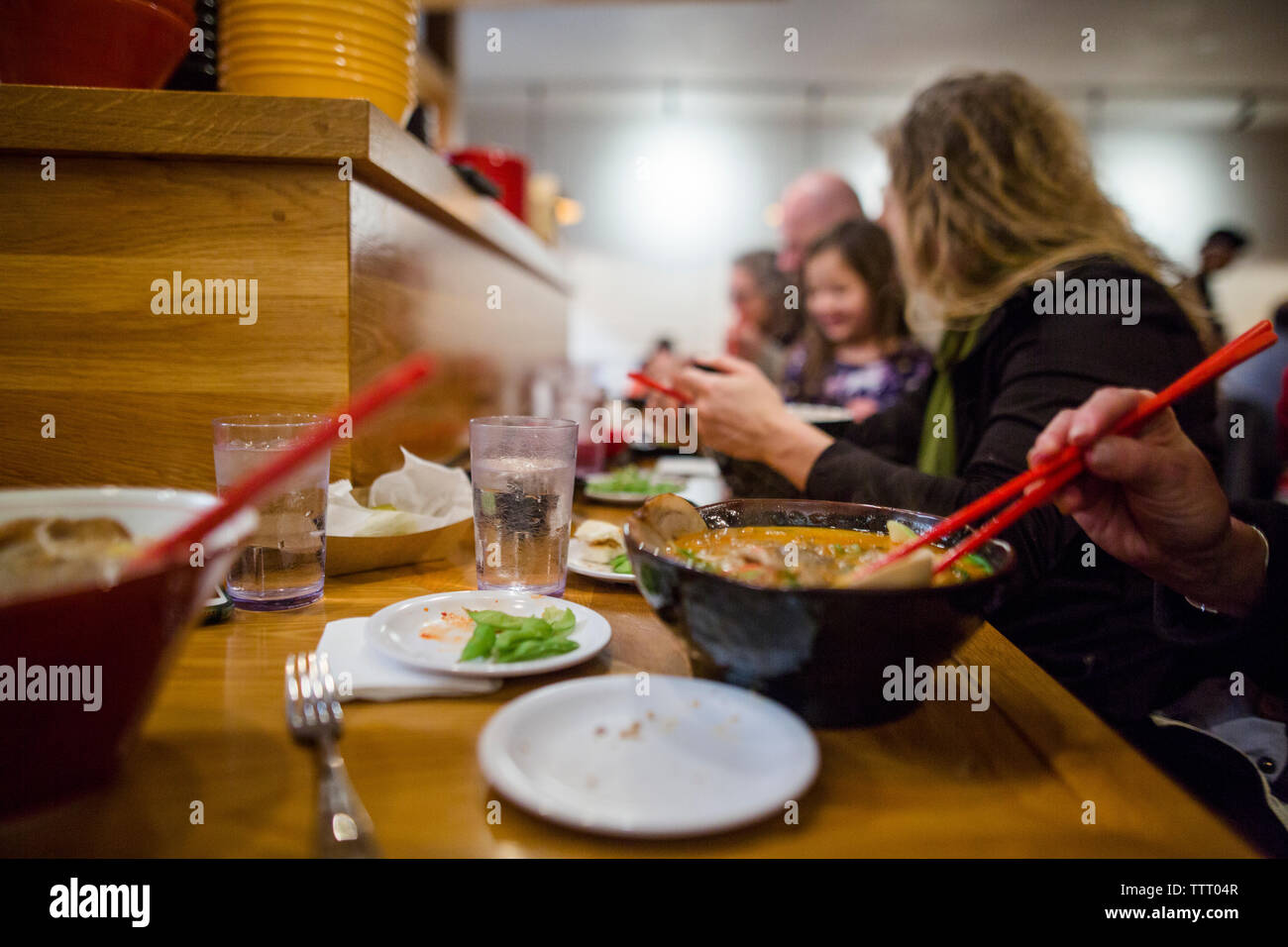 Asian family eating dinner table hi-res stock photography and images ...